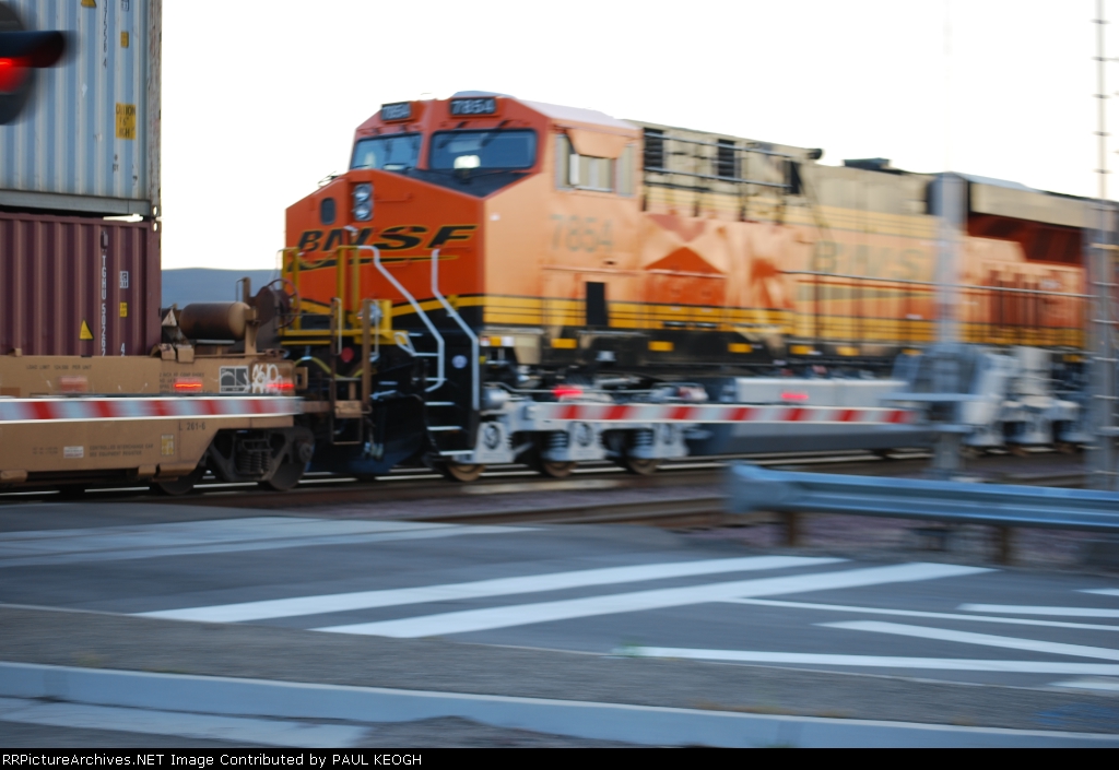 BNSF 7854 crosses over the Daggett-Yermo Road as she rolls west as the # 4 unit on a westbound Z ...